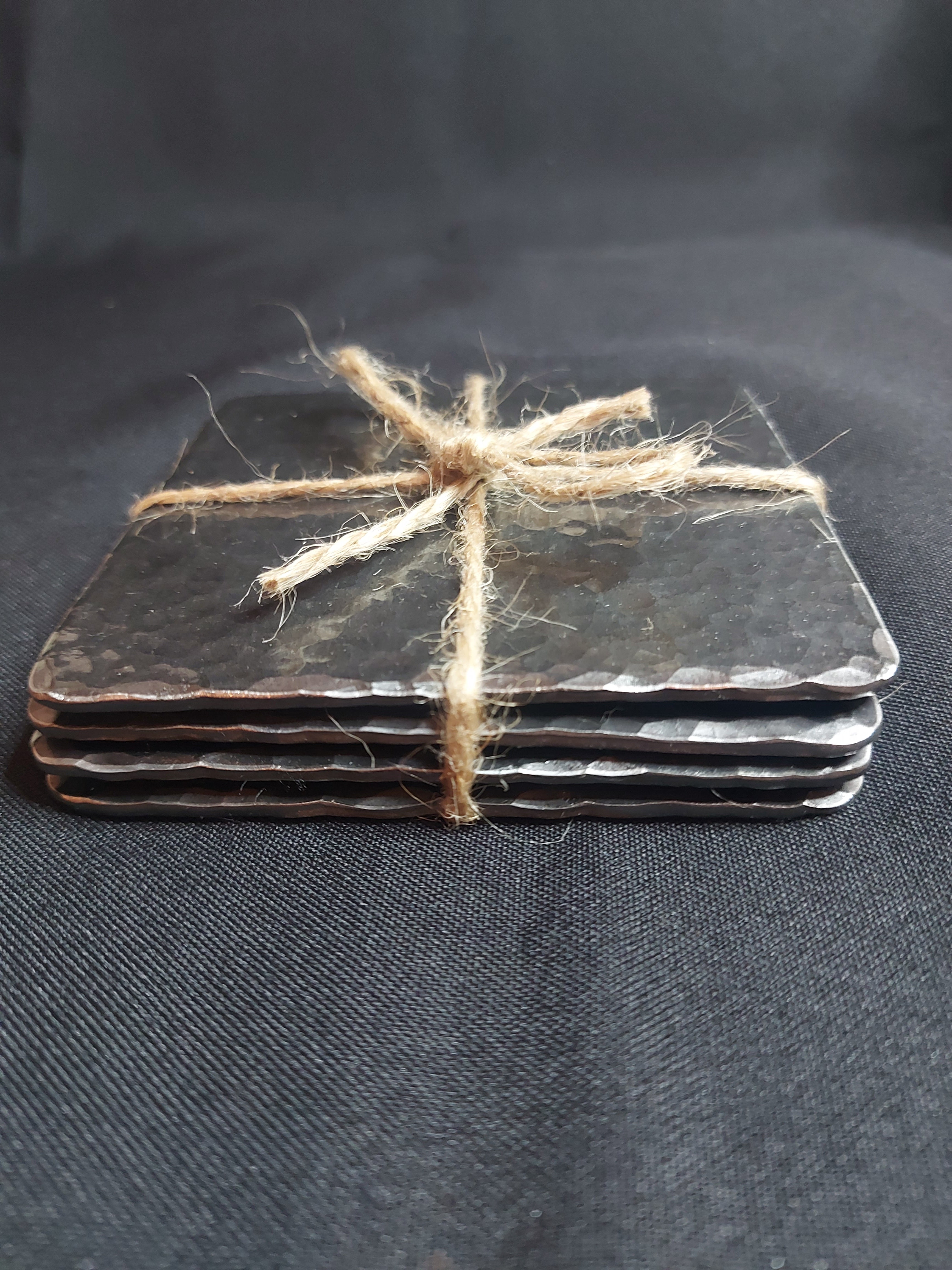 Set of 4 hammered effect steel coasters – mandometalsmith